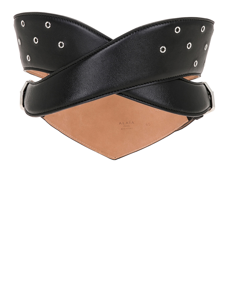 ALAÏA Crossed Belt in Noir | FWRD