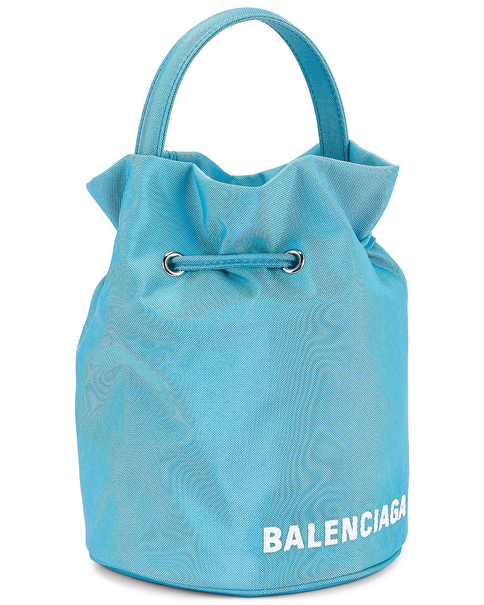 Balenciaga XS Wheel Drawstring Bucket Bag in Azur & White | FWRD