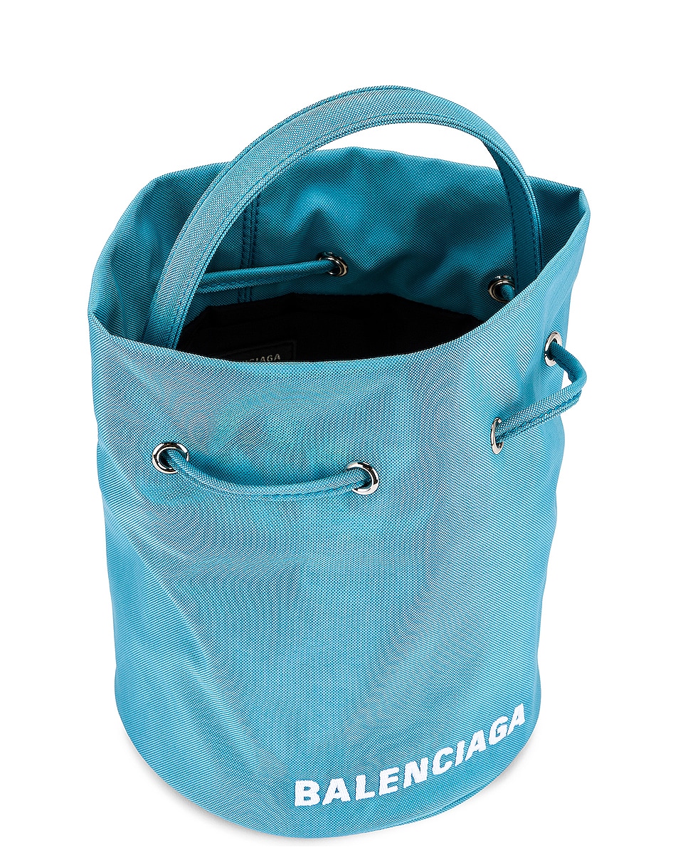 Balenciaga XS Wheel Drawstring Bucket Bag in Azur & White | FWRD