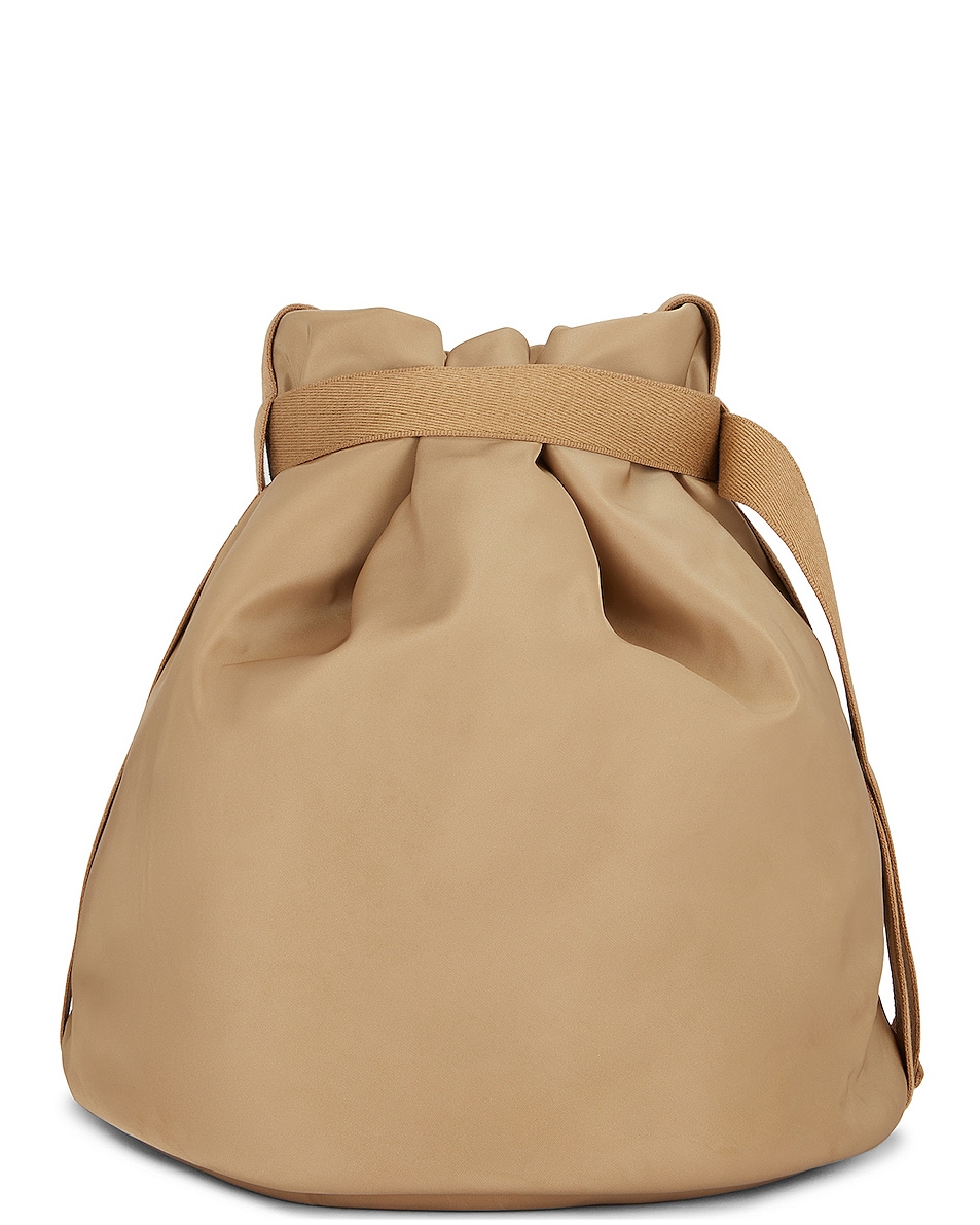 The Row Sporty Leo Bag in Beige | FWRD