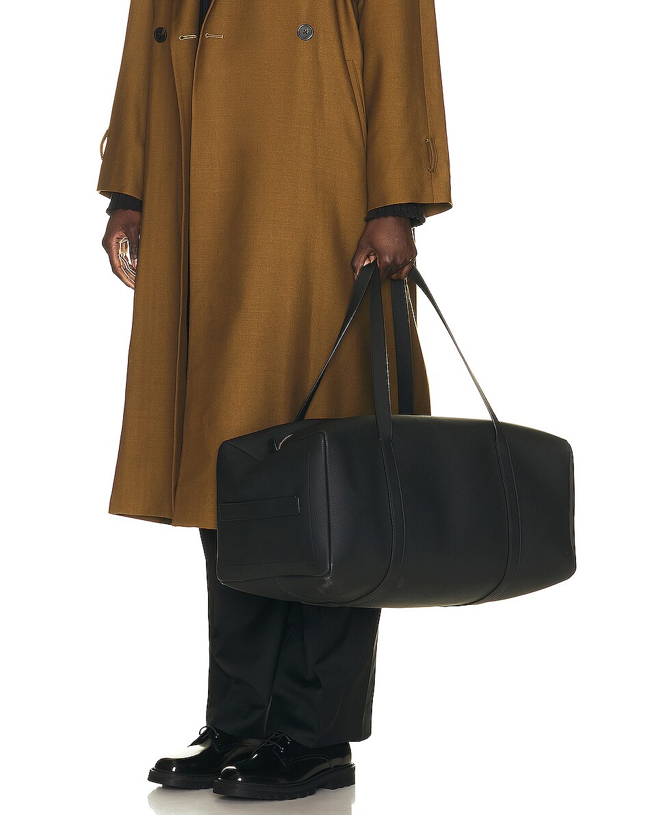 The Row Gio Duffle Bag in Black | FWRD