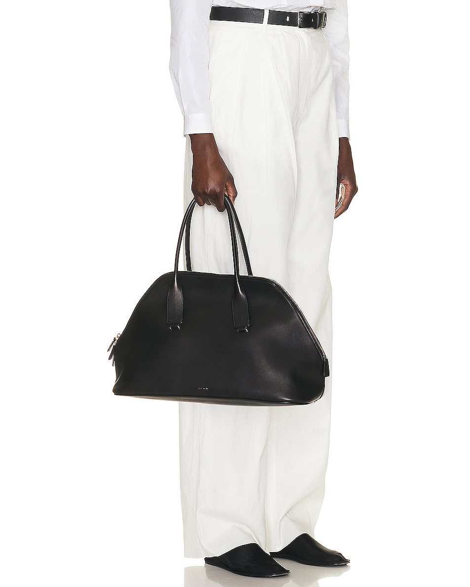 The Row Devon Top Handle Bag in Black | FWRD