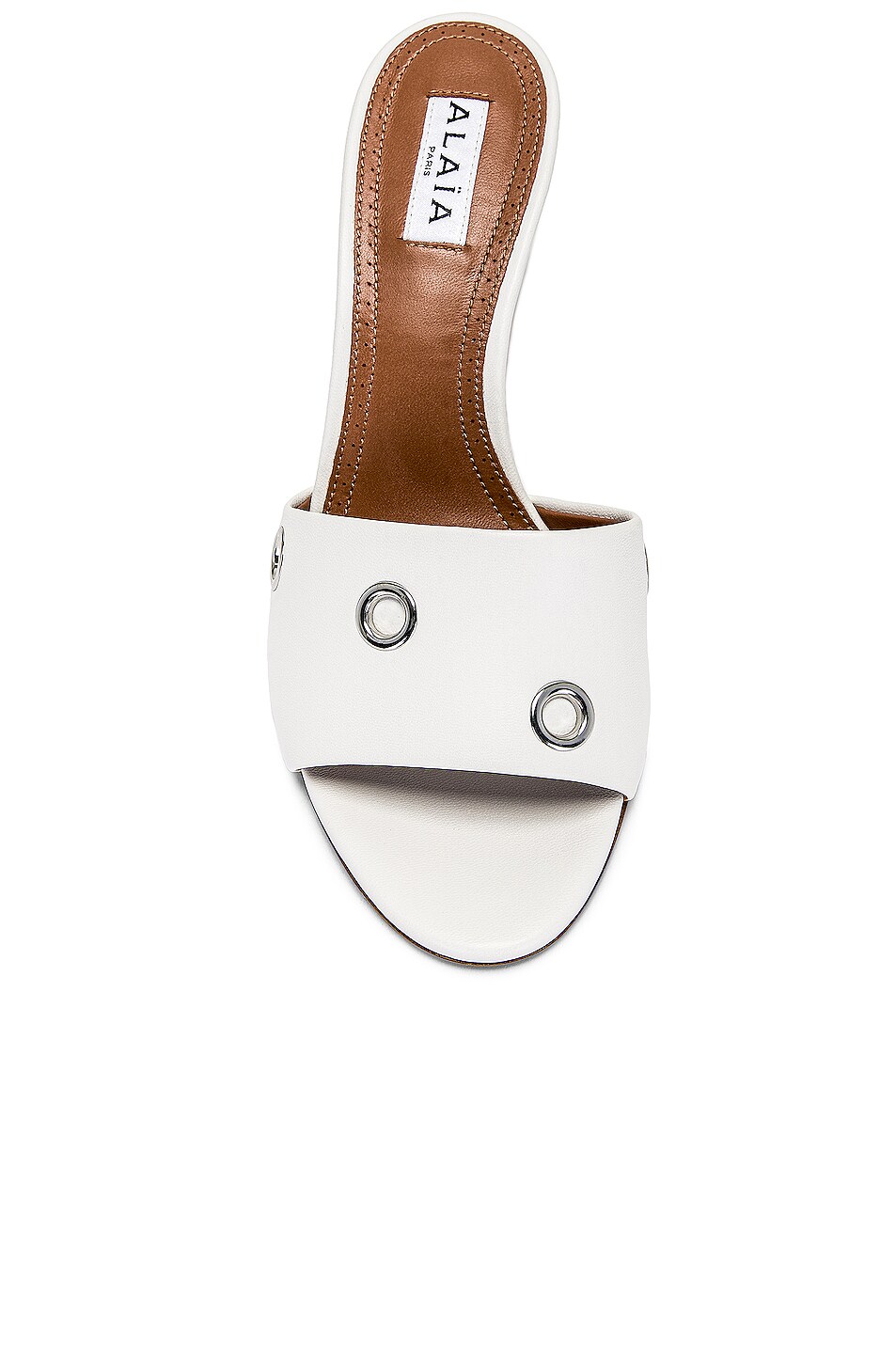 ALAÏA Eyelet Mule in Blanc Casse | FWRD