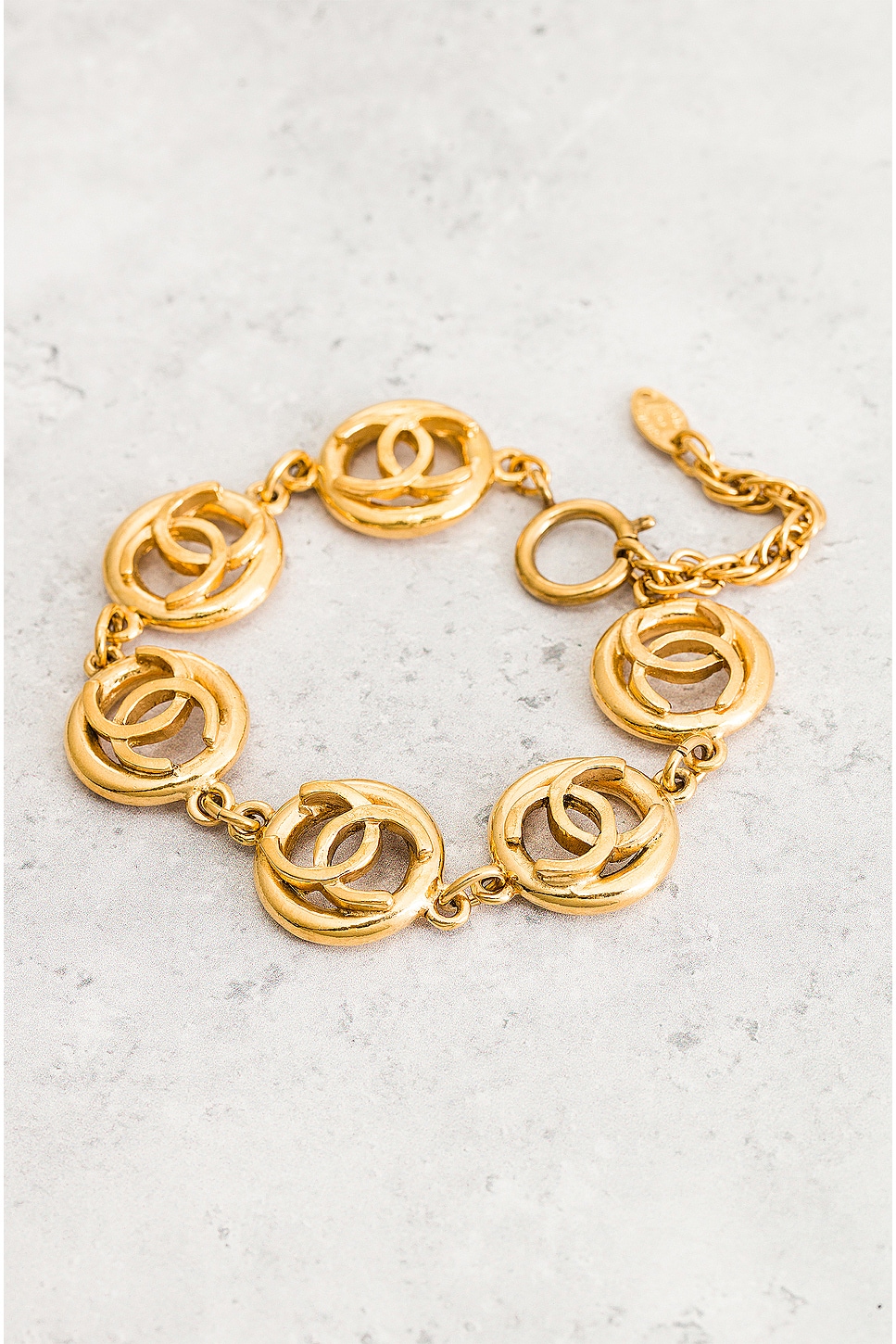 FWRD Renew Chanel Coco Mark Bracelet in Gold | FWRD