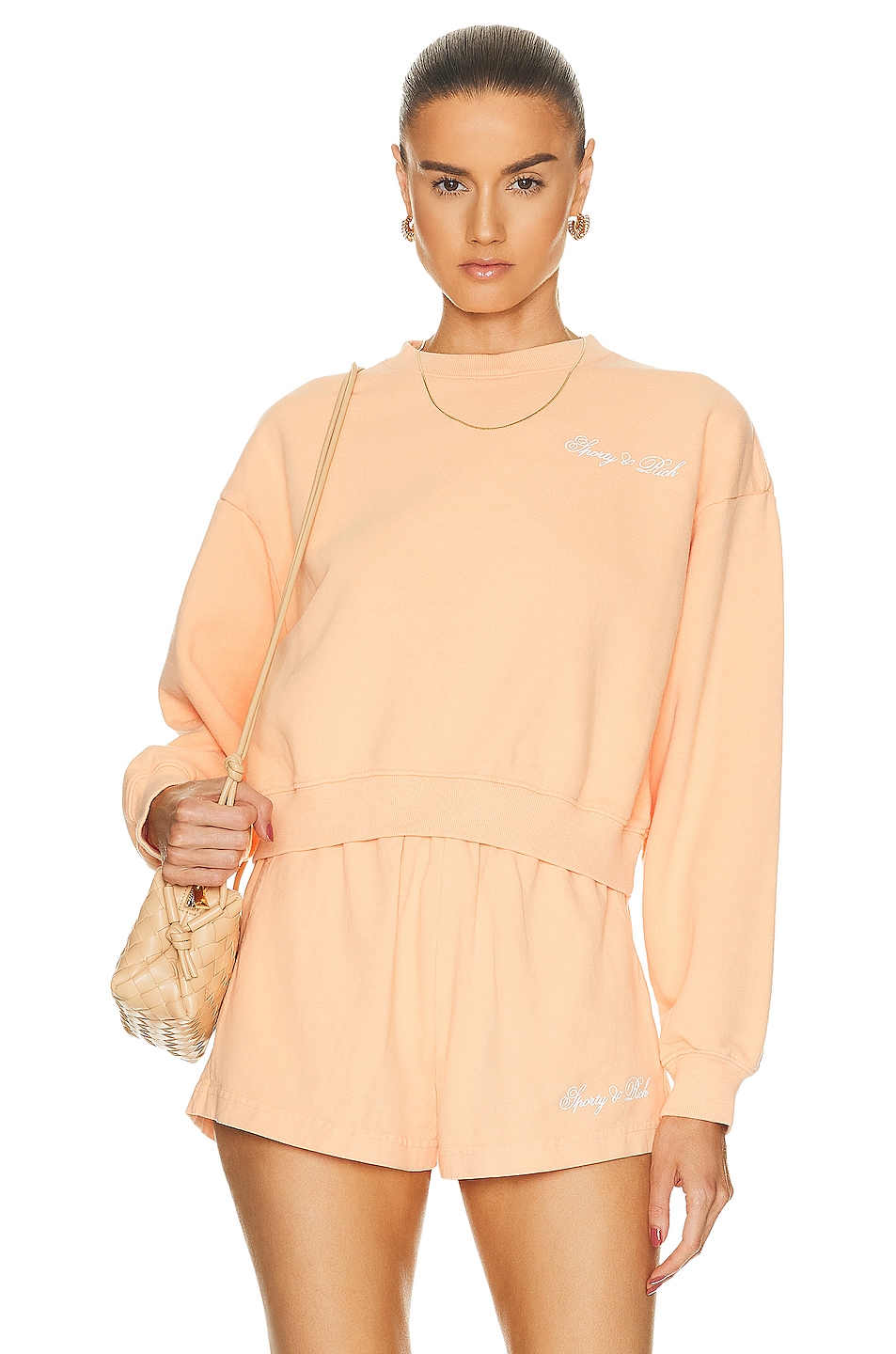 Sporty & Rich Cursive Logo Cropped Crewneck Sweatshirt in Peach & White ...